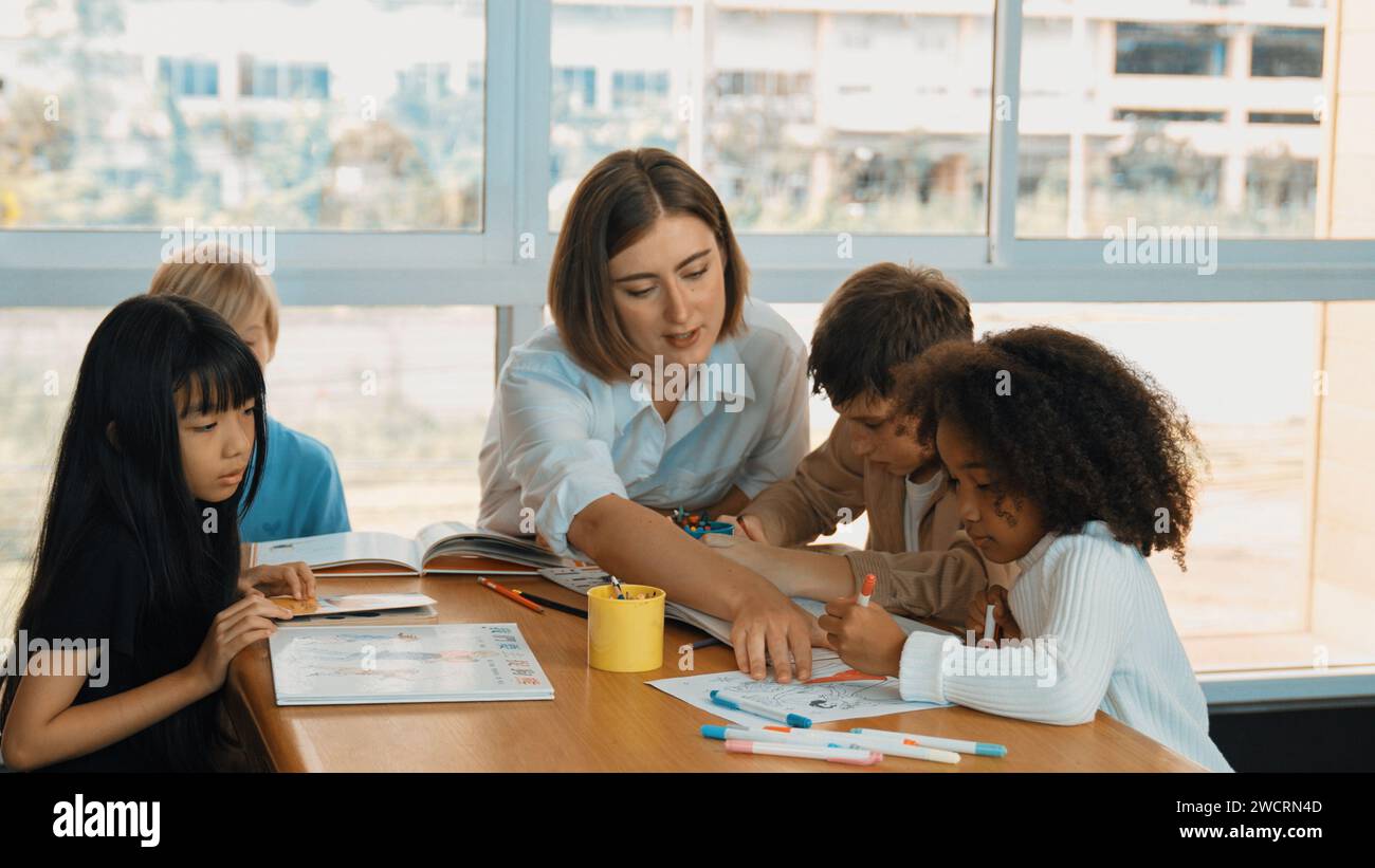 Professional caucasian teacher telling story to diverse student while ...
