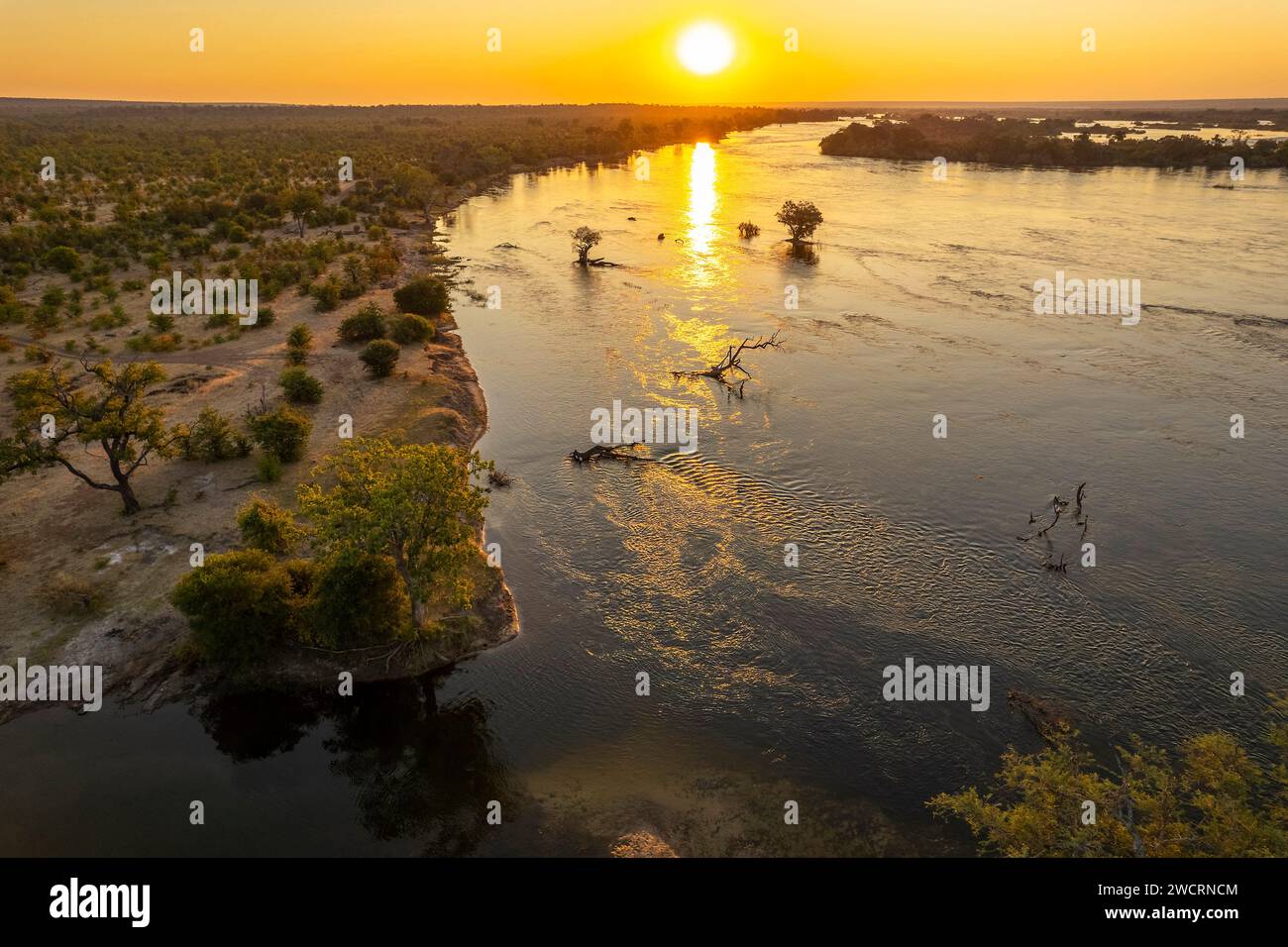 The sunrise can be seen over the Zambezi River in Zimbabwe's Zambezi ...