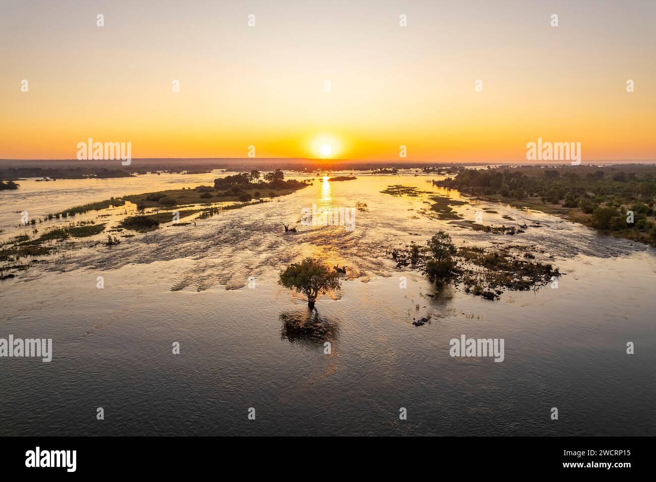 The sunrise can be seen over the Zambezi River in Zimbabwe's Zambezi ...