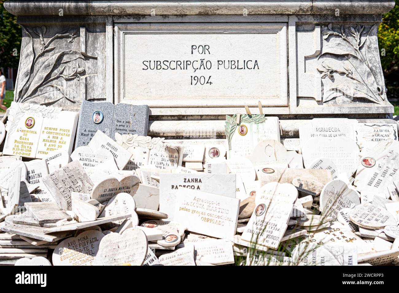 statue in honor of Dr.Sousa Martins with plaques of tombs as a thank ...