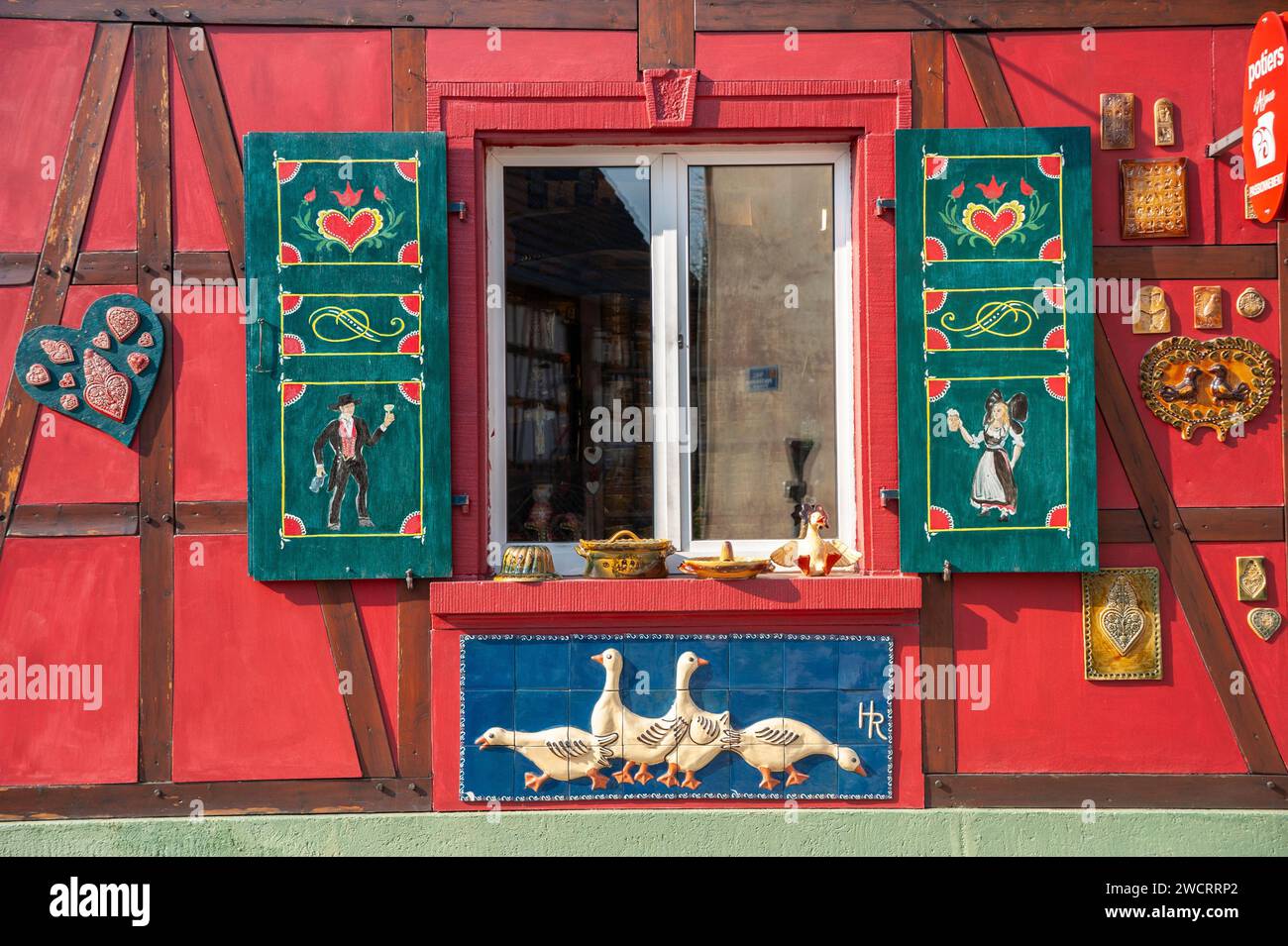 Historical half-timbered facade with ceramics and pottery items ...
