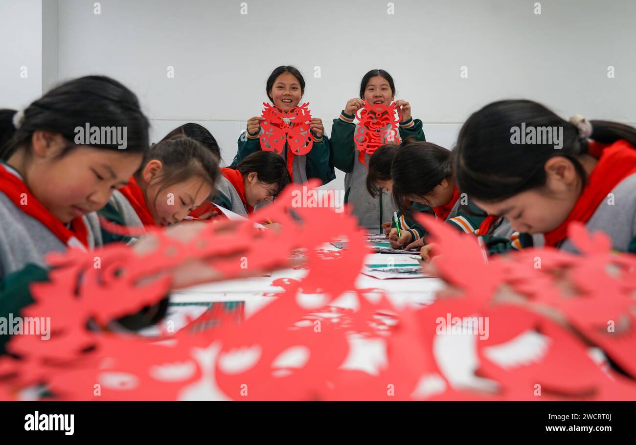 SUQIAN, CHINA - JANUARY 17, 2024 - Children from a paper-cutting club ...