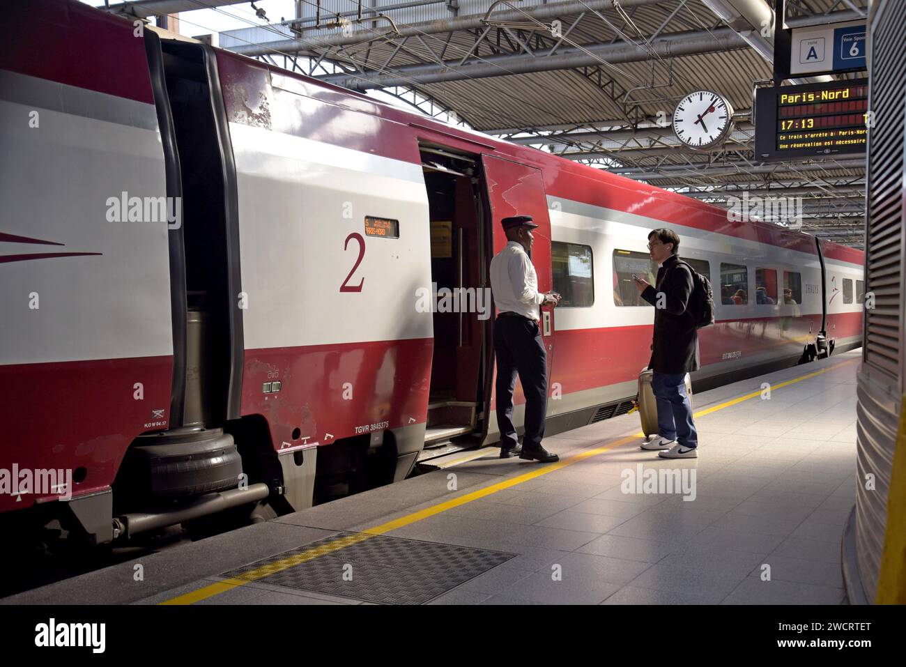 Passengers getting on a Thalys inter city high speed train to Paris ...