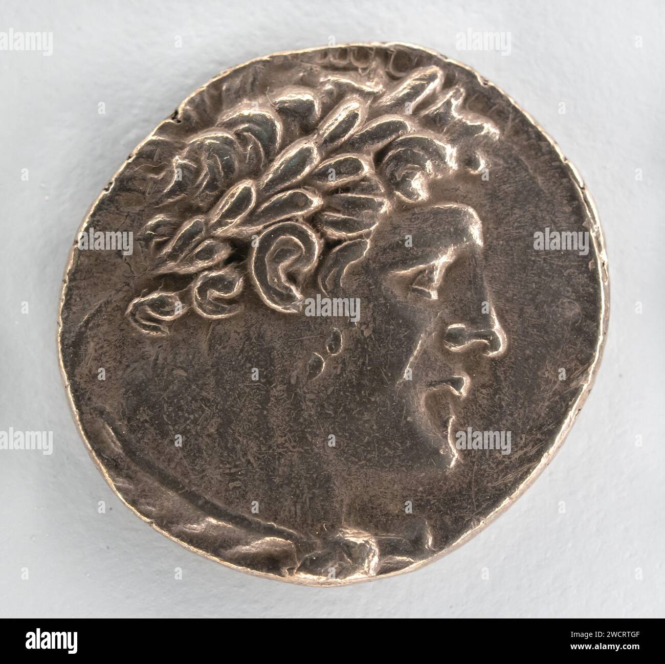 Ancient silver coin bearing a portrait of Melqart the god of Tyre who ...