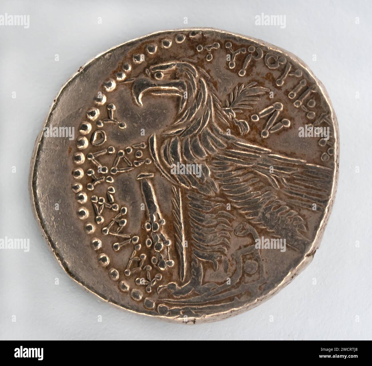 Ancient silver coin bearing a n image of an eagle of the Phoenician ...