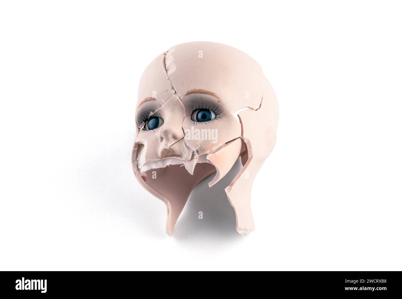 Broken vintage doll head isolated on white background with clipping ...