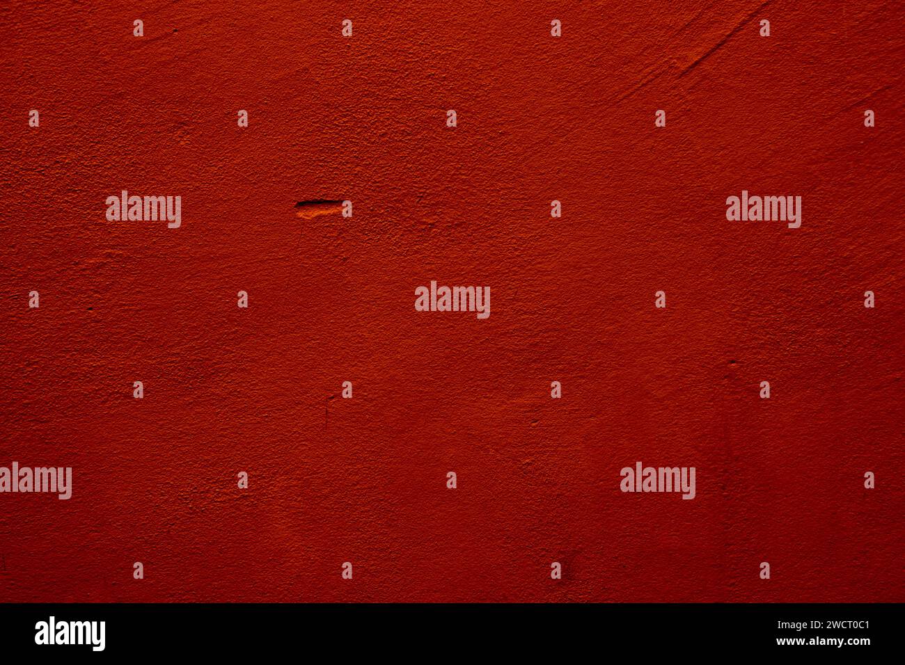 Crimson red colored abstract wall background with textures of different ...