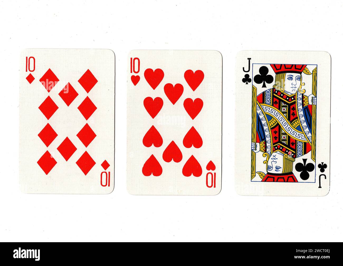 Vintage playing cards showing a pair of red tens and a black jack ...