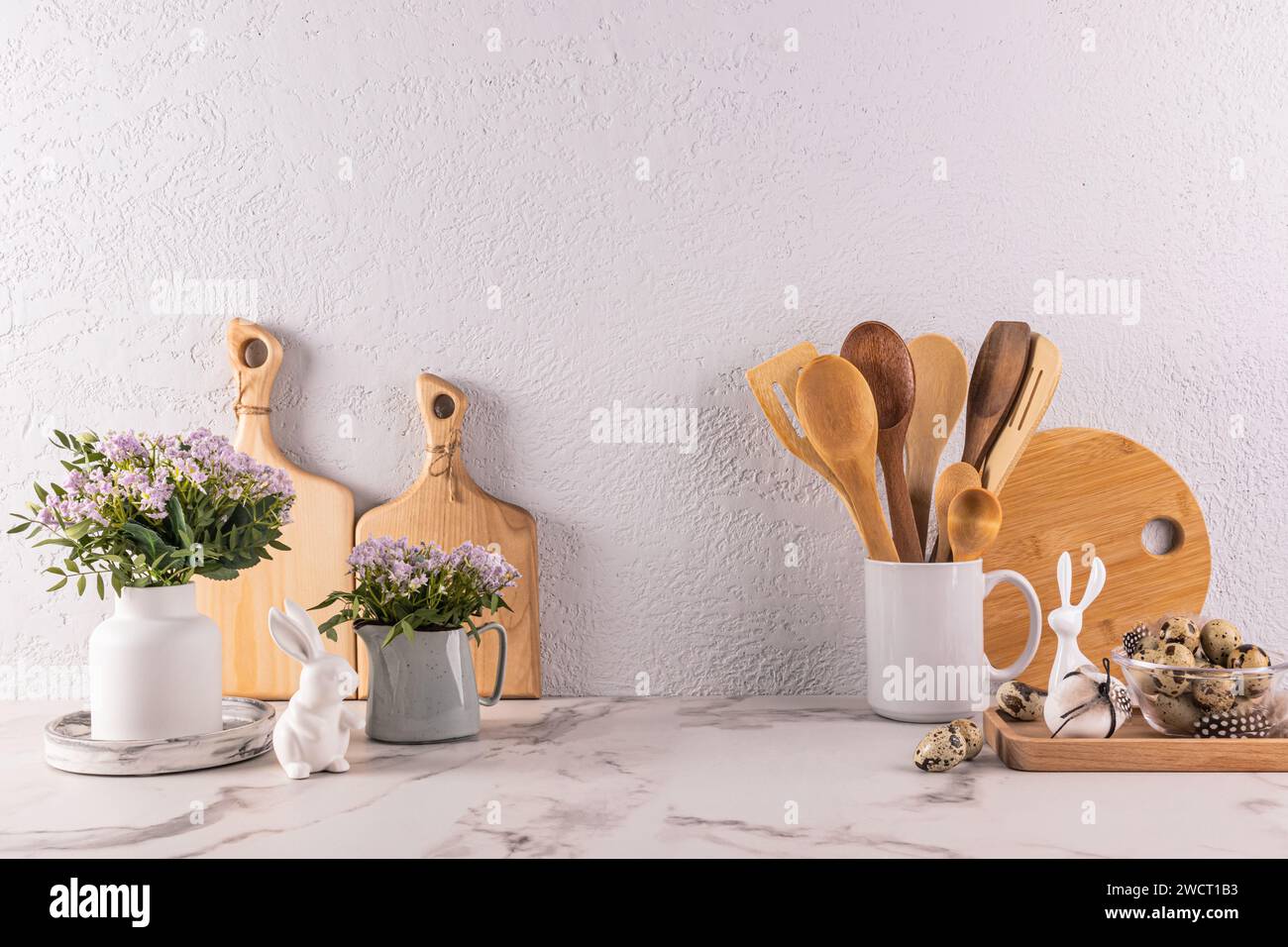Wooden kitchen utensils made of eco-friendly materials, spring flowers ...