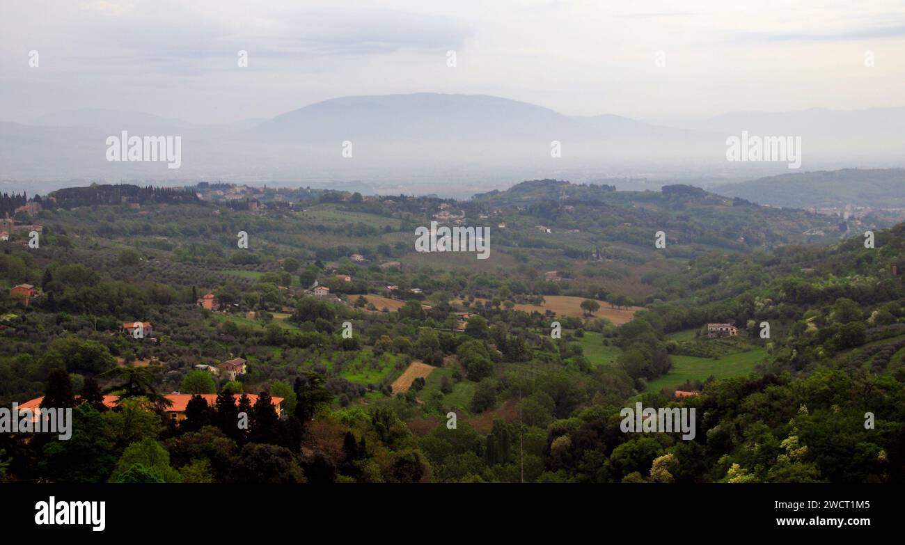 A scenic view of a breathtaking vista of a valley dotted with houses ...