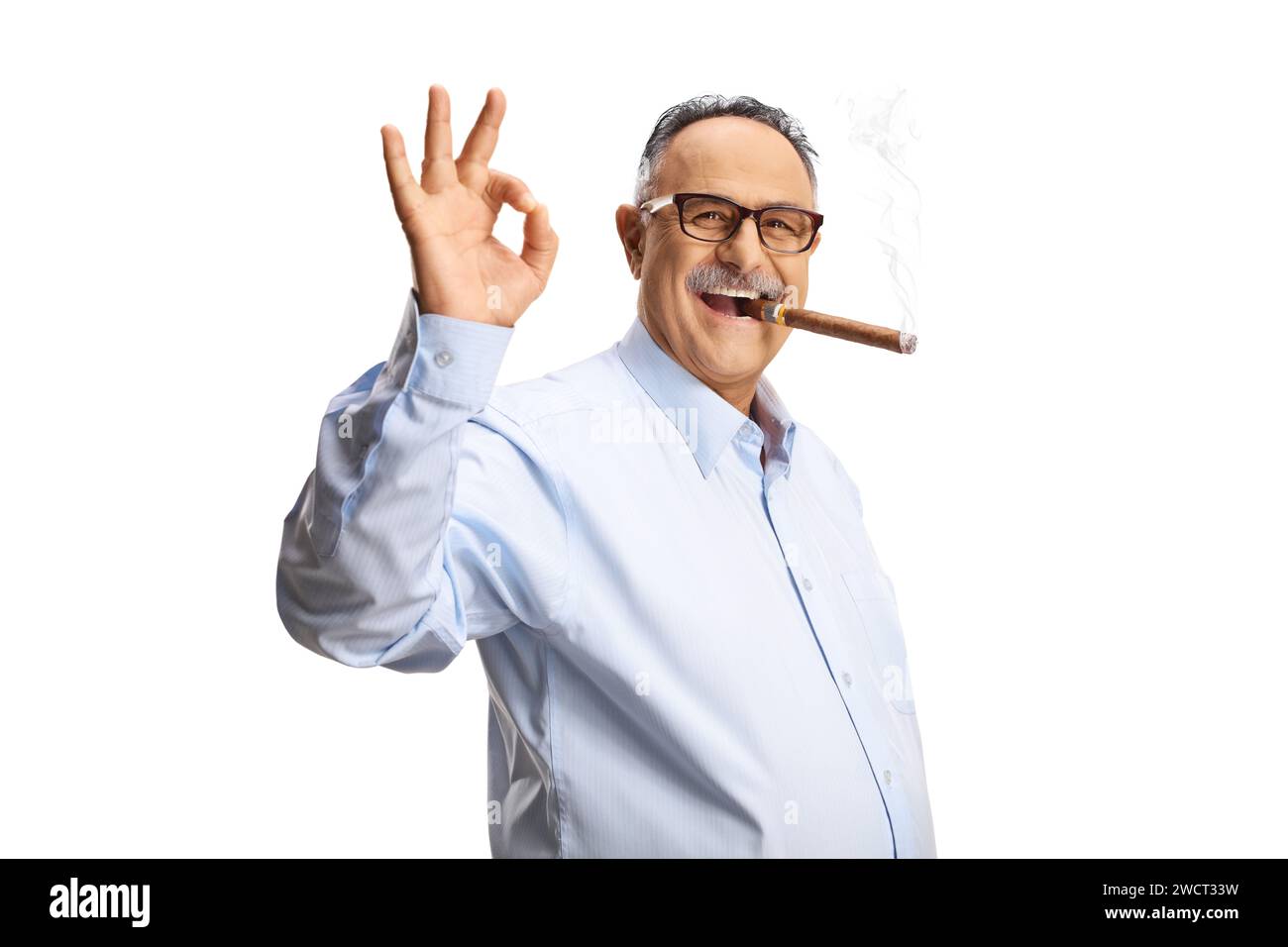 Cheerful ature gentleman smoking a cigar and gesturing ok sign isolated ...