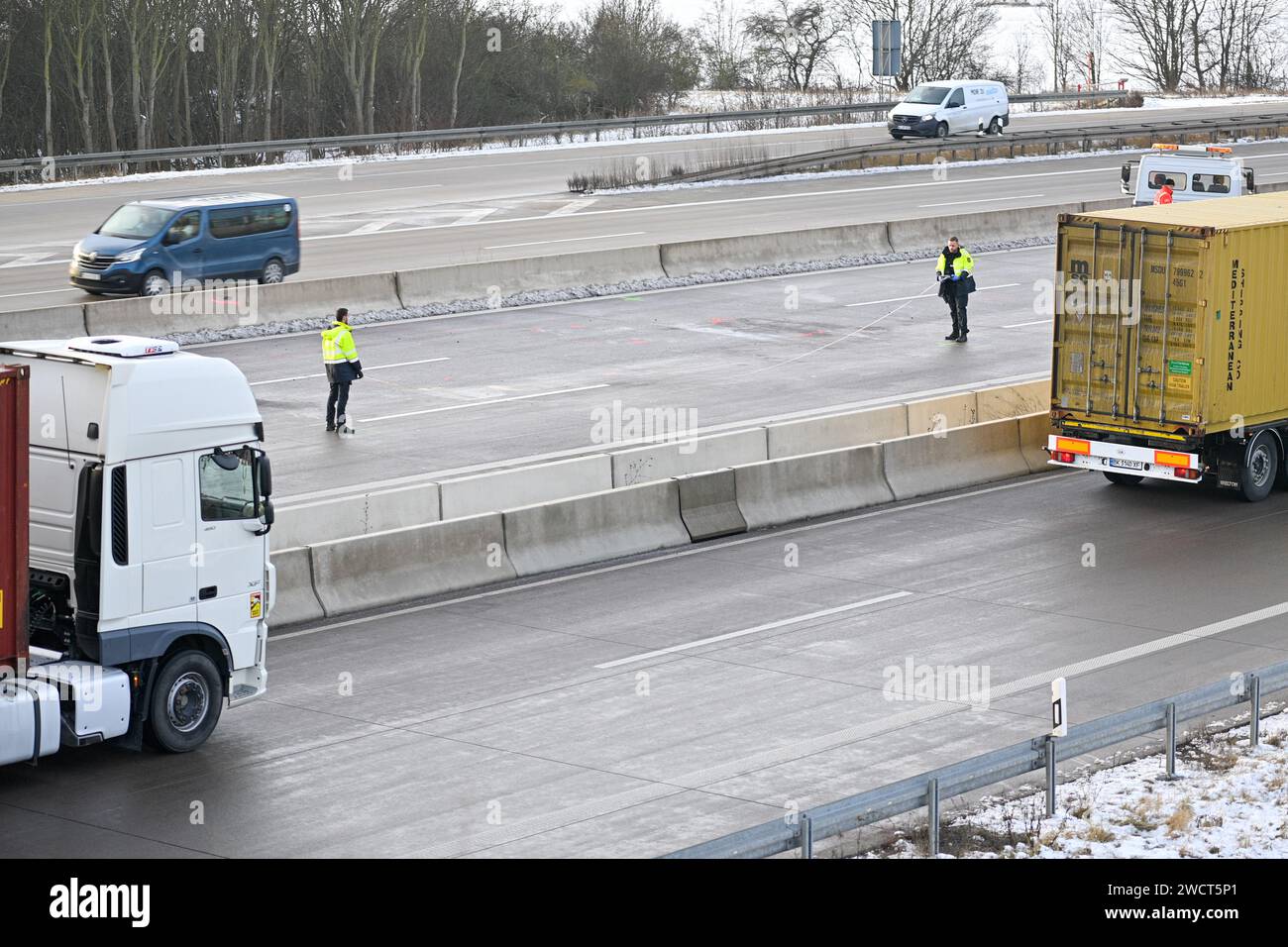 Magdeburg, Germany. 17th Jan, 2024. Police officers survey the scene of ...