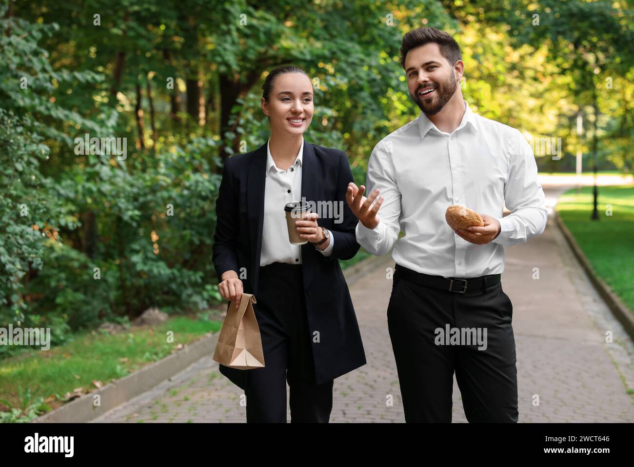 Business lunch. Happy colleagues spending time together during break in ...
