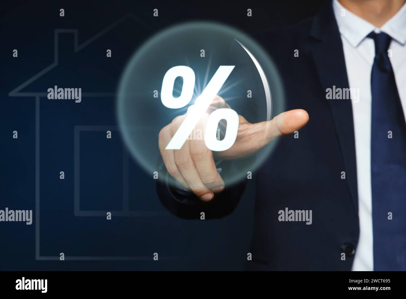 Mortgage. Man pressing sphere with percent sign against dark blue ...