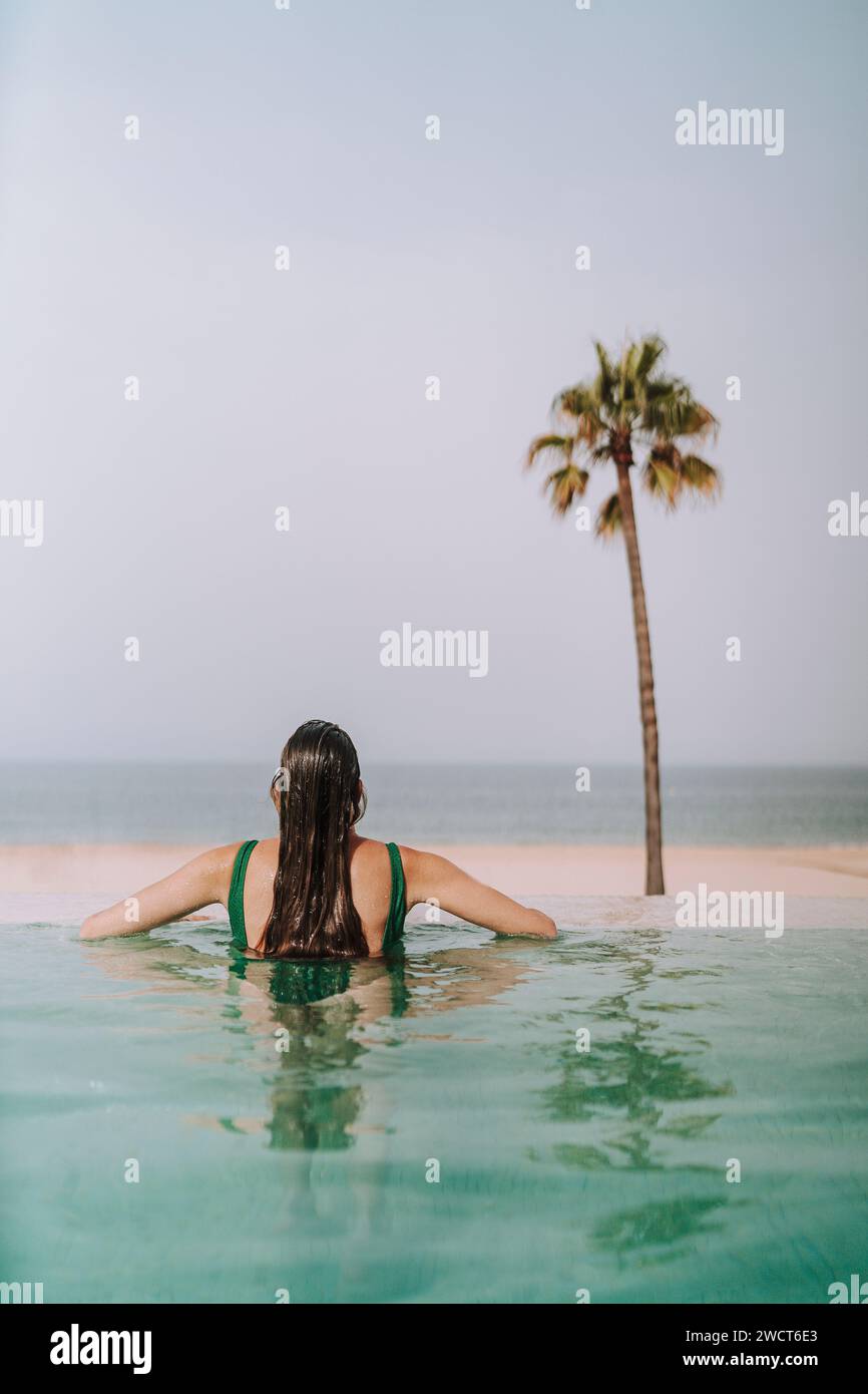 An elegant lady enjoying a moment of tranquility in a luxurious ...