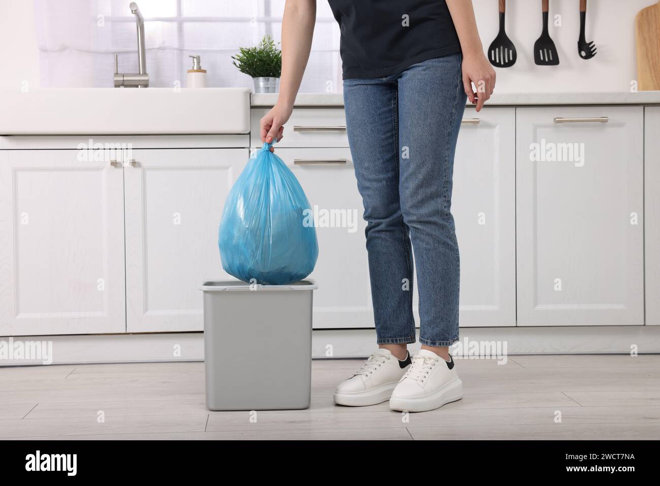 Taking out rubbish female hi-res stock photography and images - Alamy