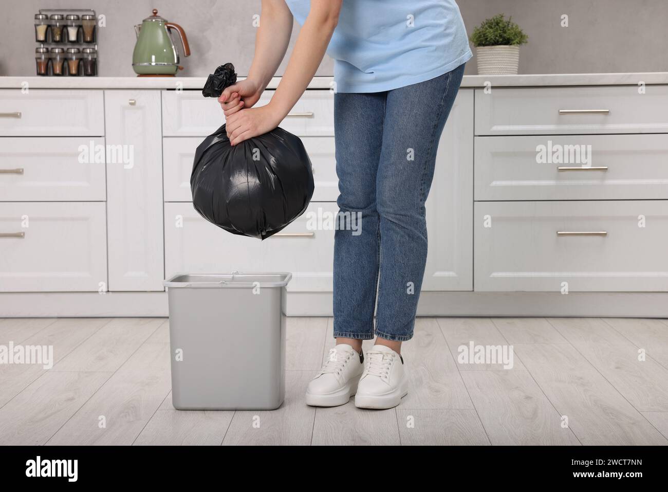 Woman black bin bag hi-res stock photography and images - Alamy