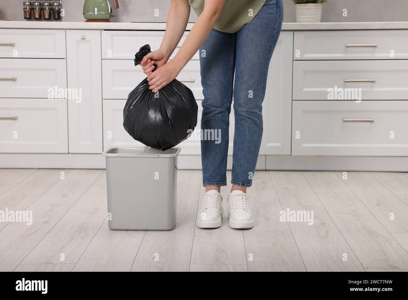 Taking out rubbish female hi-res stock photography and images - Alamy