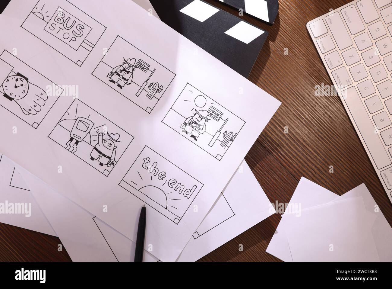 Storyboard with cartoon sketches at workplace, flat lay. Pre-production ...