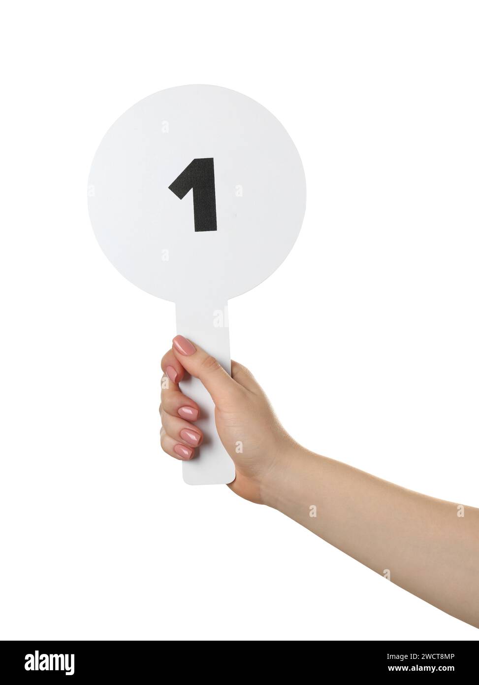 Woman holding auction paddle with number 1 on white background, closeup ...