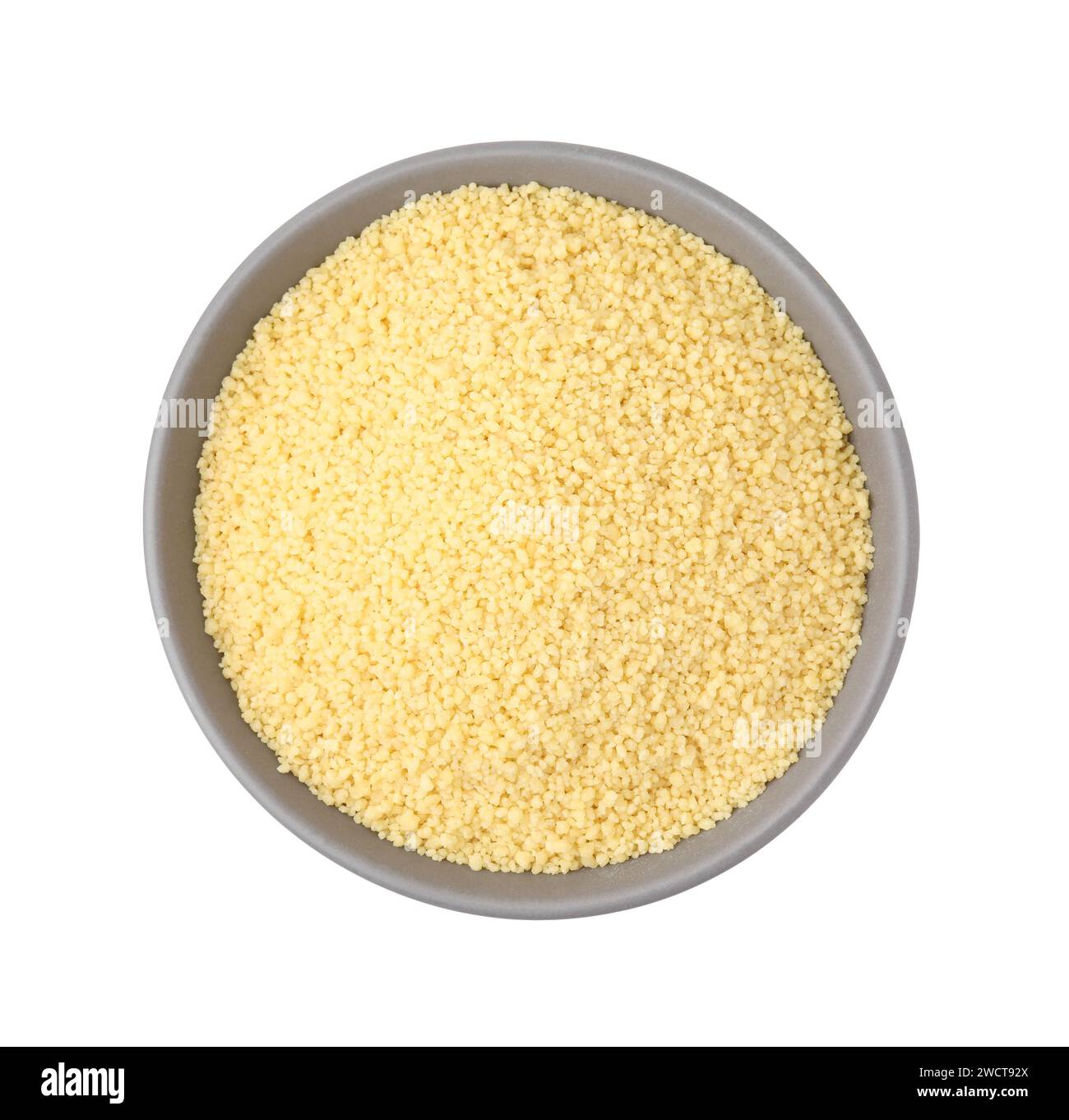 Raw couscous in bowl isolated on white, top view Stock Photo - Alamy