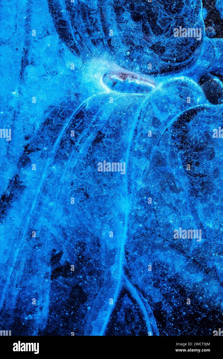 Close up deep blue grooves in ice, flowing like a river, capturing the ...