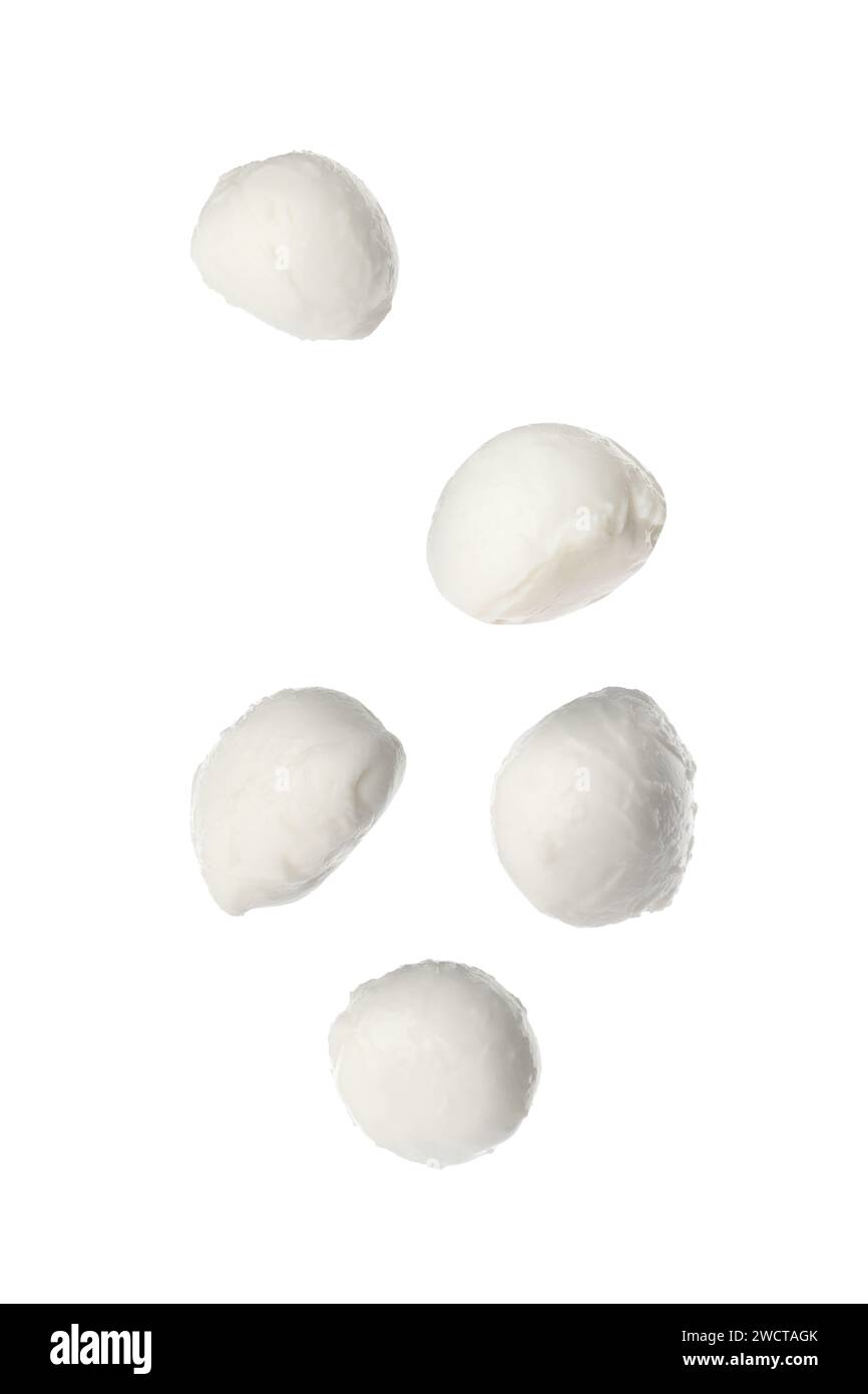 Fresh mozzarella balls falling on white background Stock Photo - Alamy