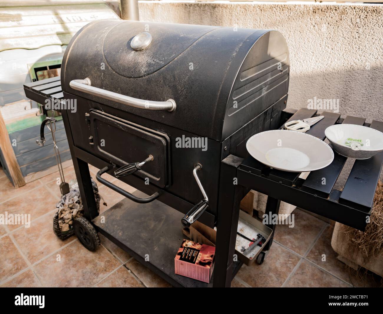 High angle of contemporary outdoor metal charcoal barbecue grill with ...