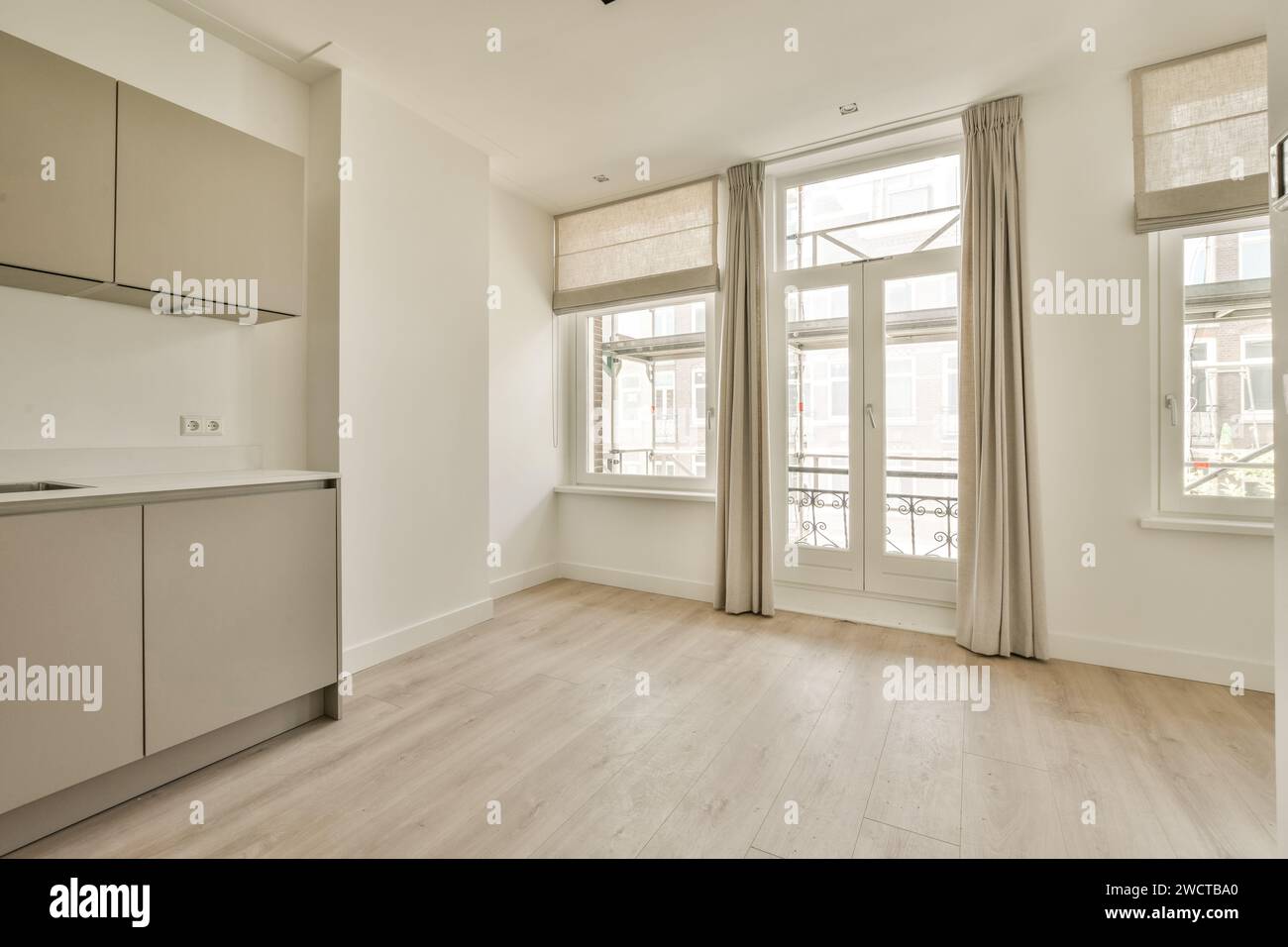 Closed windows and doors in empty living room at modern apartment with ...