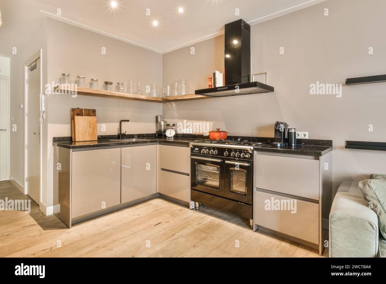 Rangehood over stove in modern kitchen at contemporary apartment with ...