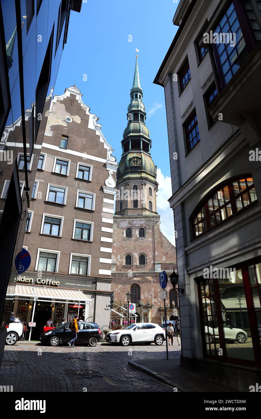 An ensemble of new and old buildings on the streets of Riga. Bell tower ...