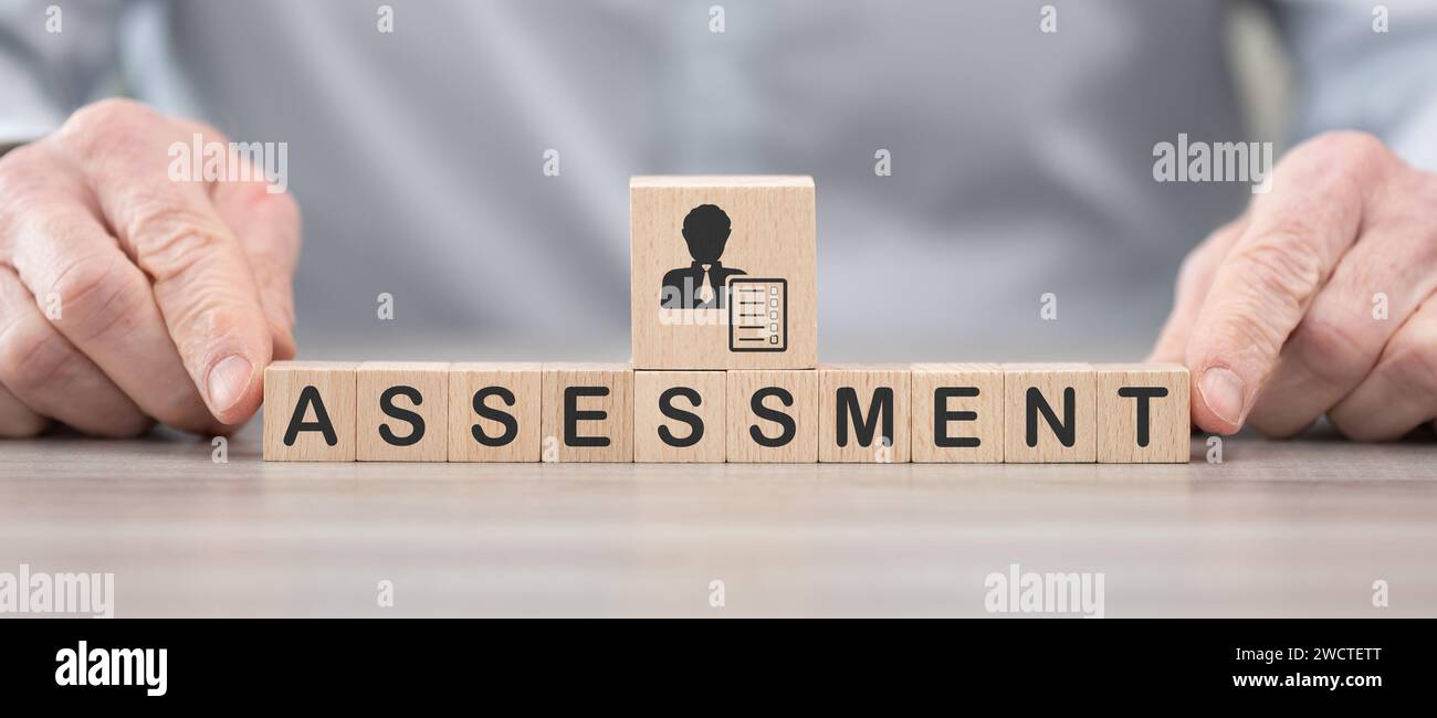Wooden blocks with symbol of assessment concept Stock Photo - Alamy