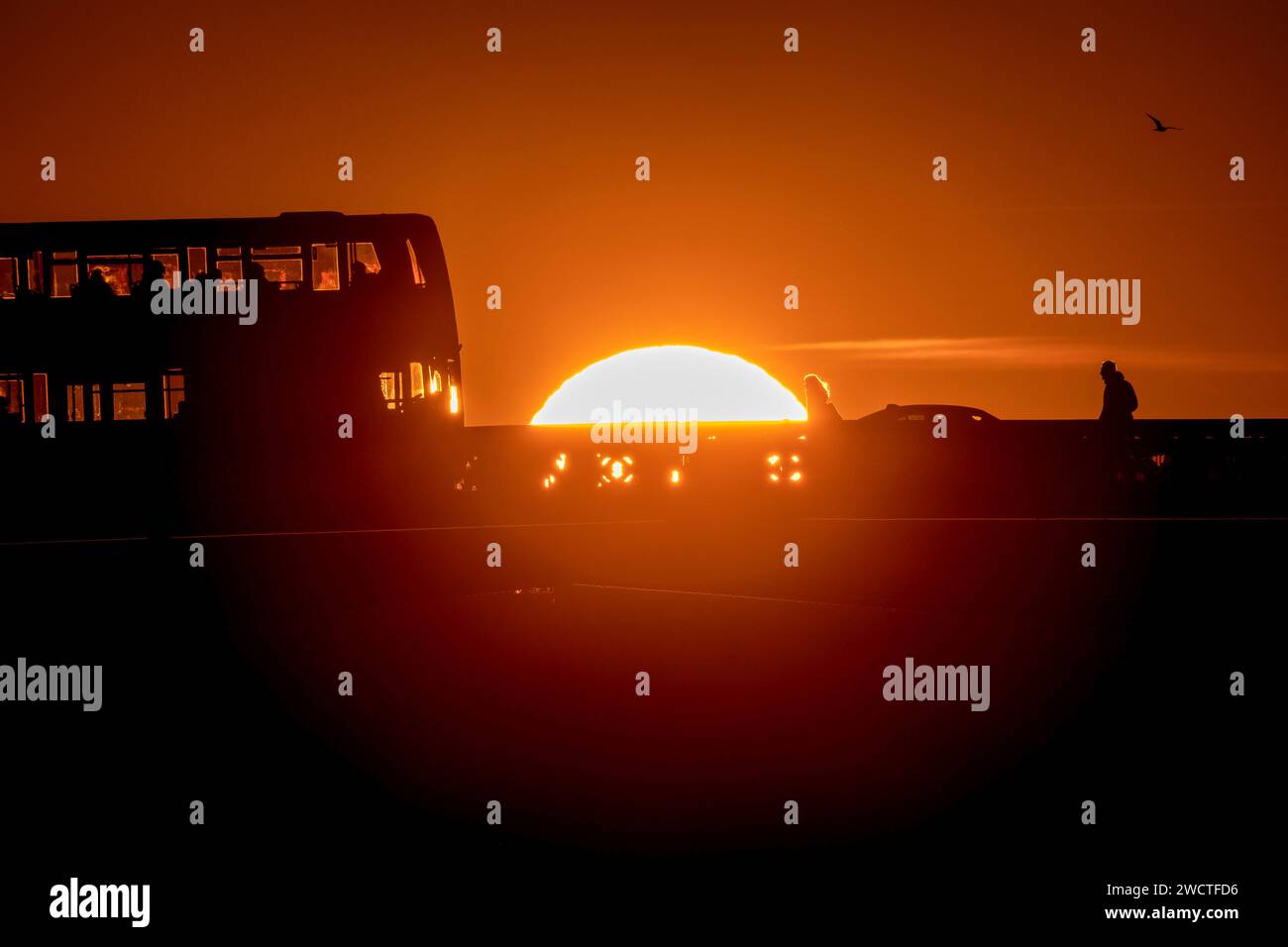 The sun rises behind Tower Bridge in London as temperatures drop across ...