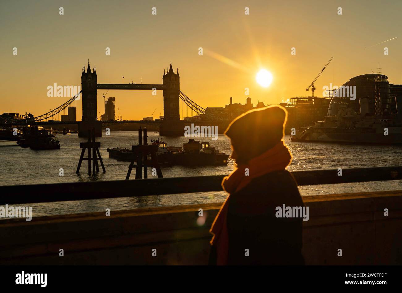 The sun rises behind Tower Bridge in London as temperatures drop across ...