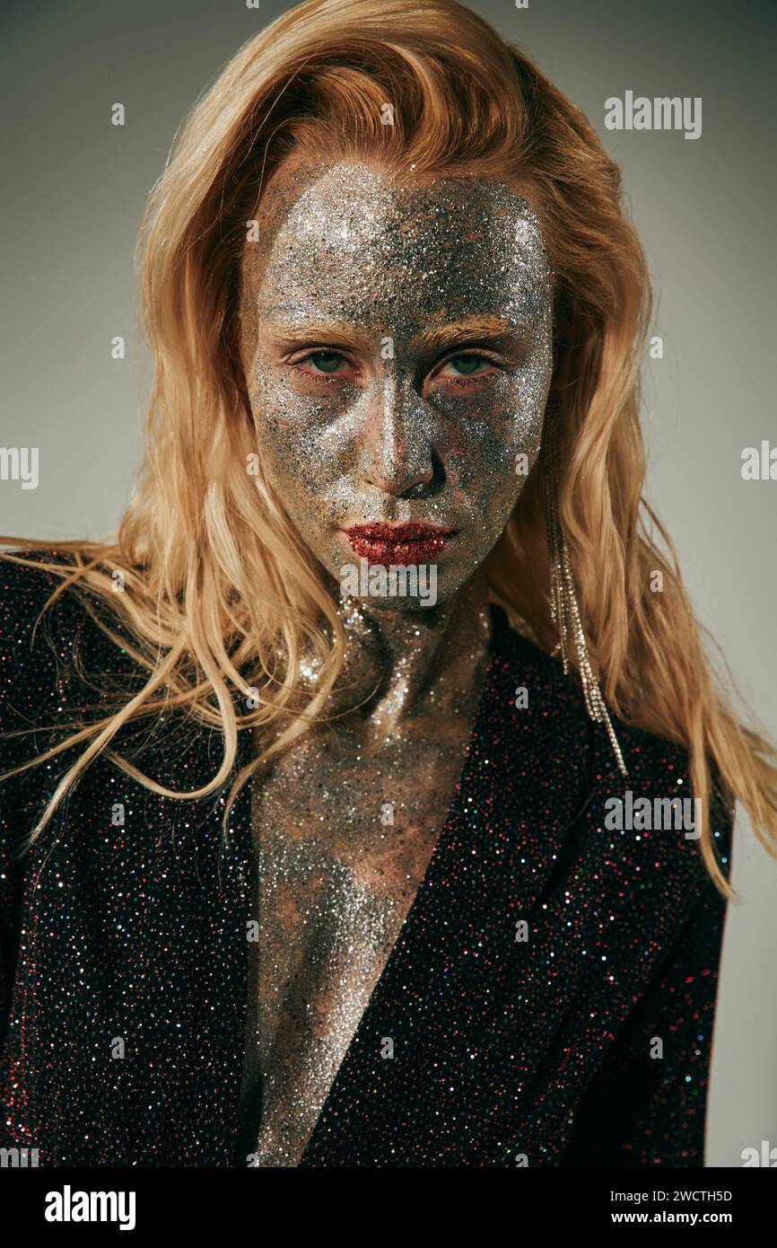 portrait of blonde woman with green eyes and glitter all over body and ...