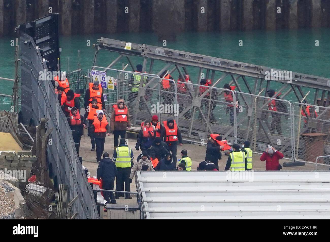 A group of people thought to be migrants are brought in to Dover, Kent ...