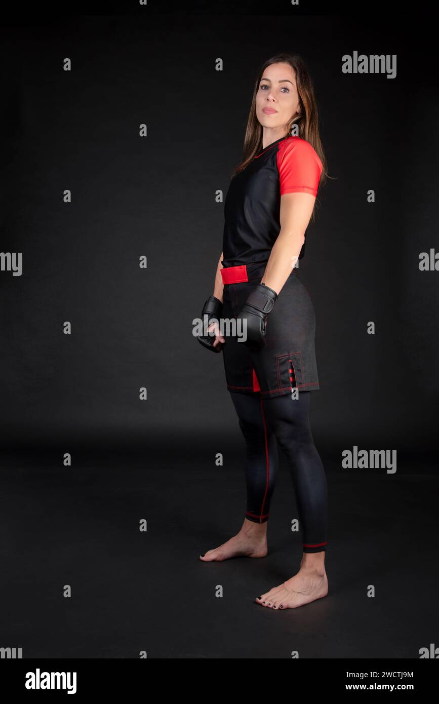 The Caucasian MMA instructor exudes confidence with a cocky pose ...