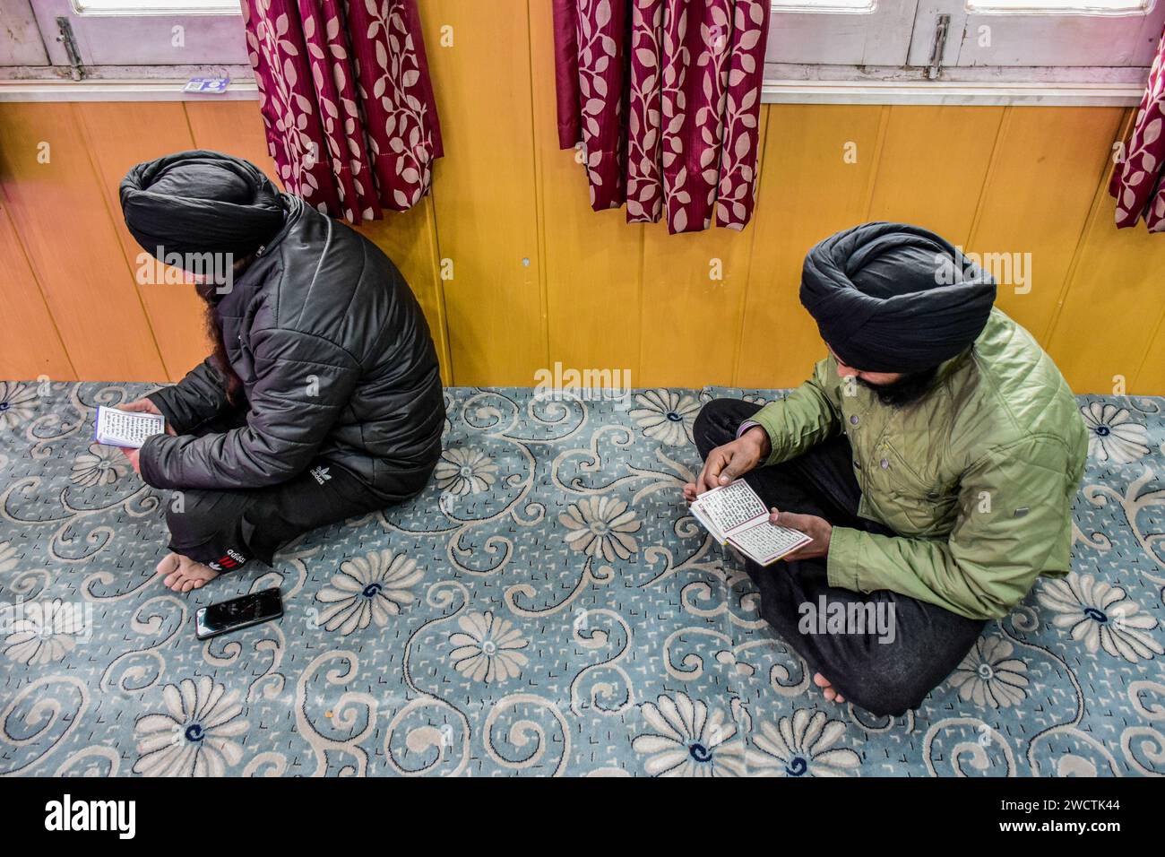Srinagar, India. 17th Jan, 2024. Sikh devotees read verses from the holy book on the occasion of ...