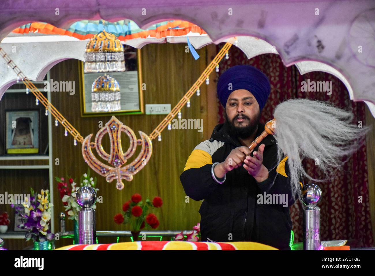 Srinagar, India. 17th Jan, 2024. A Sikh devotee perform rituals on the occasion of the 357th ...