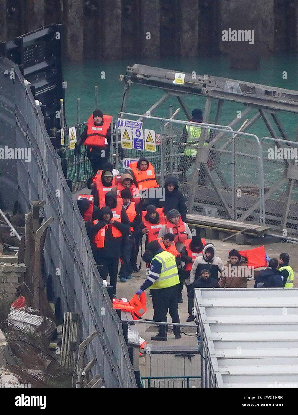 A group of people thought to be migrants are brought in to Dover, Kent ...