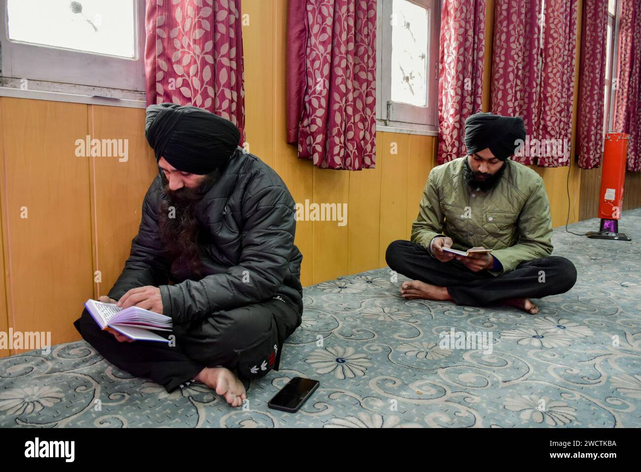 Srinagar, India. 17th Jan, 2024. Sikh devotees read verses from the holy book on the occasion of ...