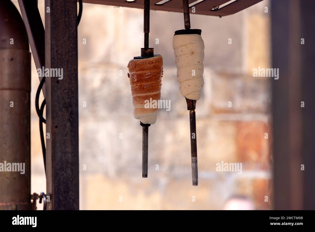Photo taken in Prague of Trdelnik, a traditional pastry, as it's being ...