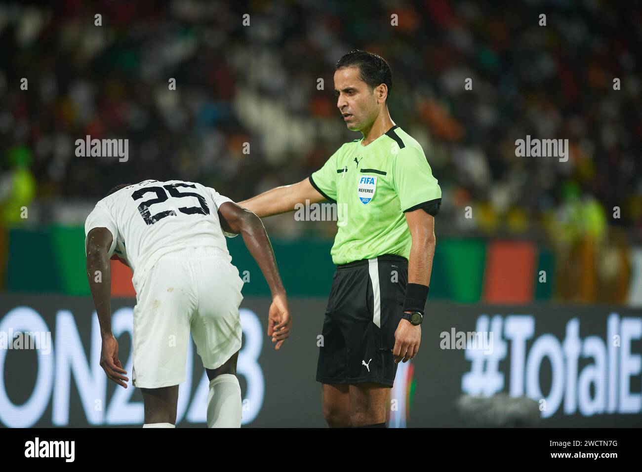 the referee Ibrahim Mutaz pointing out to Guinea's Facinet Conte Stock ...