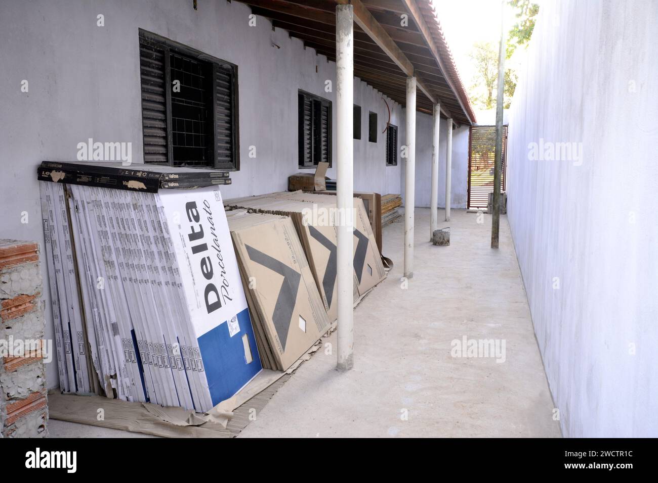 House hallway with ceramic flooring boxes in residential hallway under ...