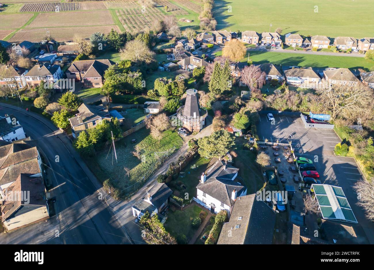aerial view of the part restored rare grade 2 listed 6 sided smock mill ...