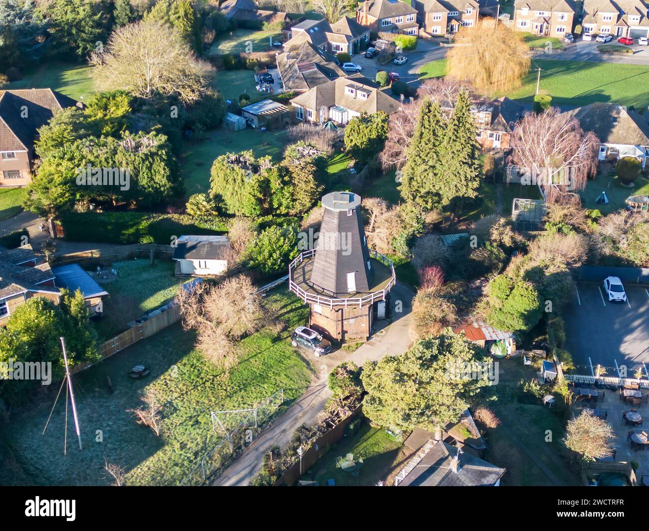 aerial view of the part restored rare grade 2 listed 6 sided smock mill ...