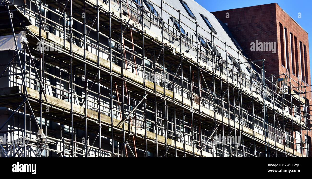 Scaffolding on a building under construction in Manchester, UK, on a ...