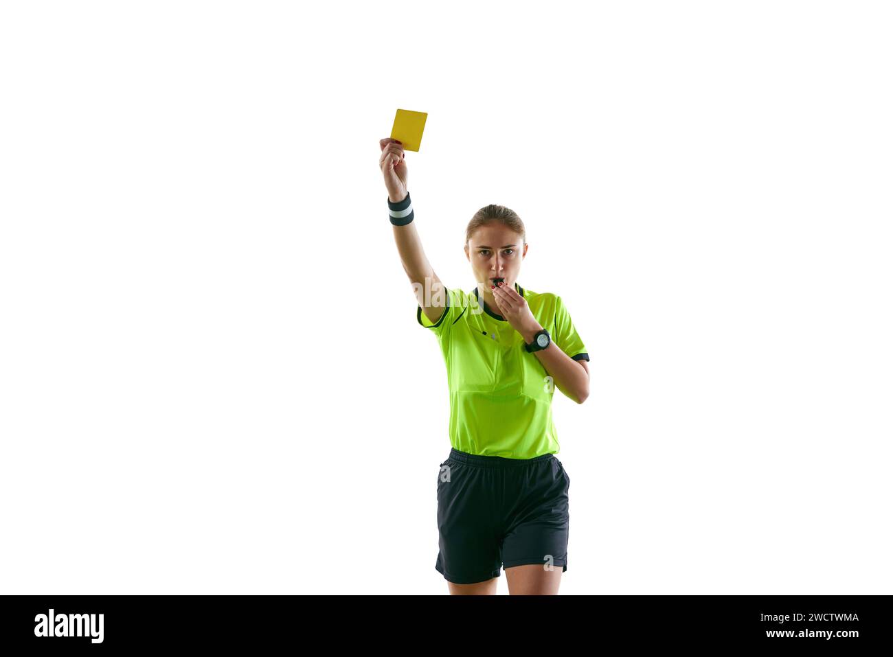 Serious woman, soccer referee gesturing, raising hand, stopping game ...
