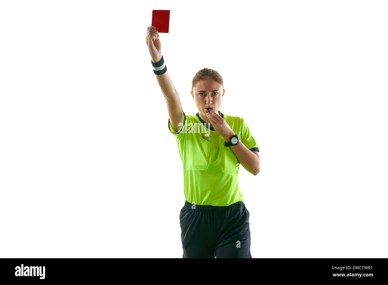 Serious woman, soccer referee gesturing, raising hand, stopping game ...