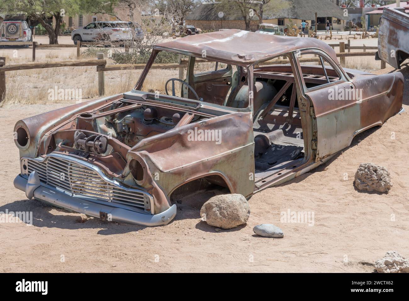vintage 50's car-body wreck worn down by rust in exibition at fuel ...